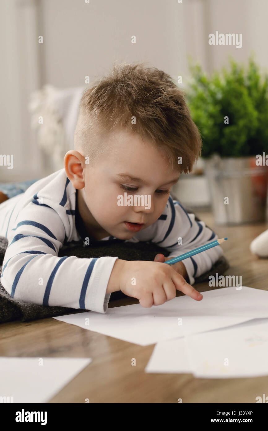 Childhood. Young boy at home Stock Photo - Alamy
