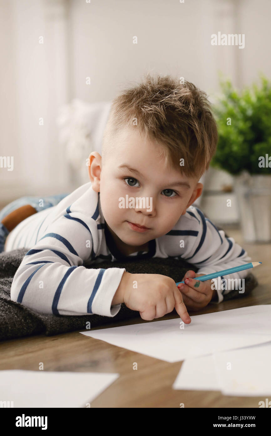 Childhood. Young boy at home Stock Photo - Alamy