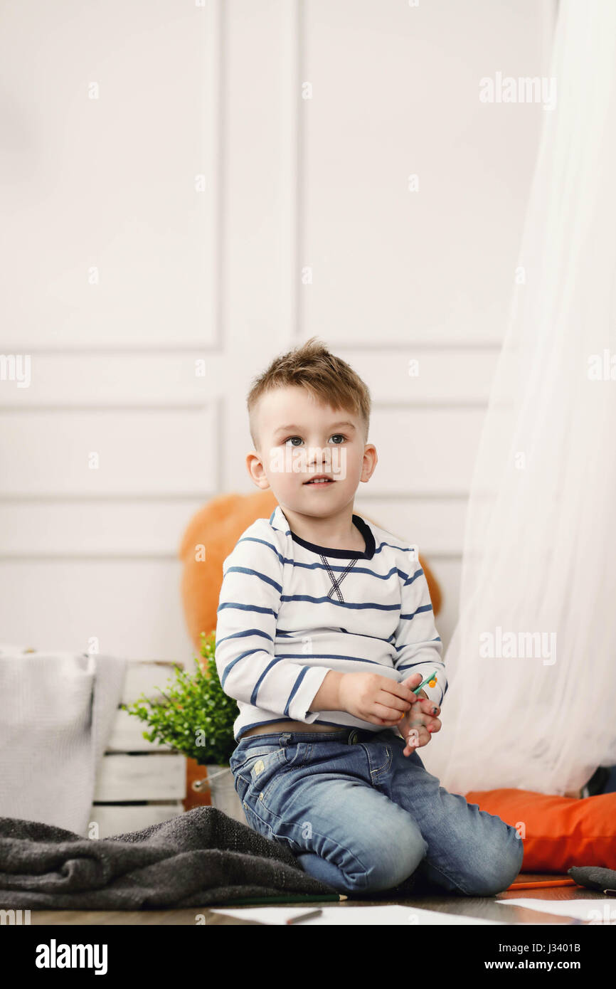 Childhood. Young boy at home Stock Photo - Alamy