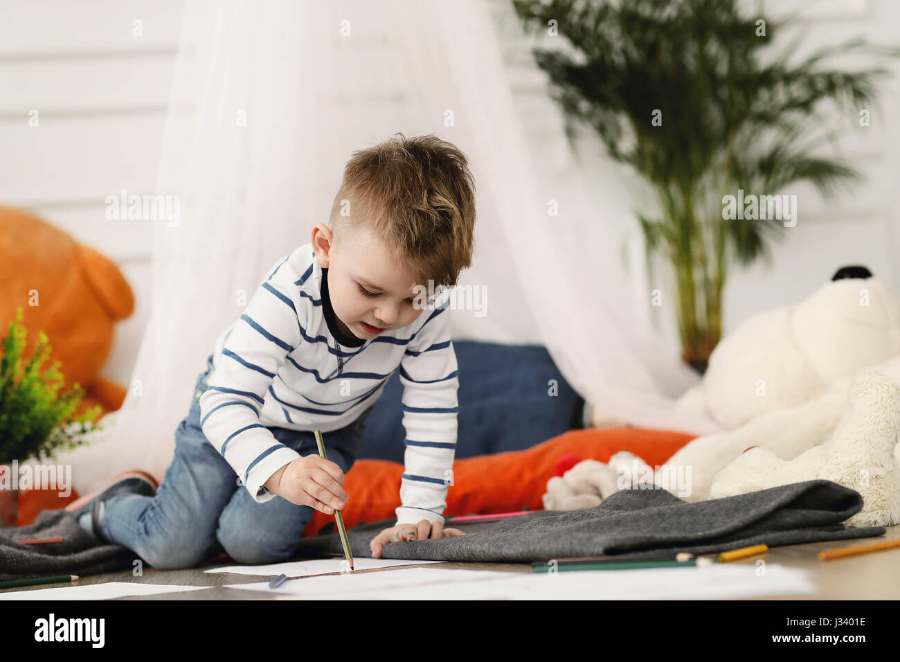 Childhood. Young boy at home Stock Photo - Alamy