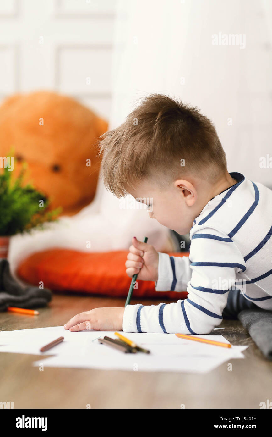 Childhood. Young boy at home Stock Photo - Alamy