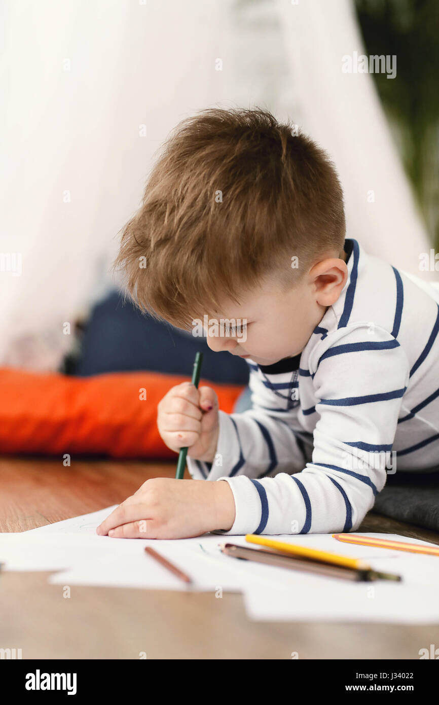 Childhood. Young boy at home Stock Photo - Alamy