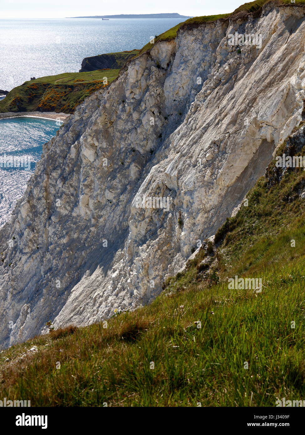 Crumbling chalk cliff and rock face from South West Coast Path between ...
