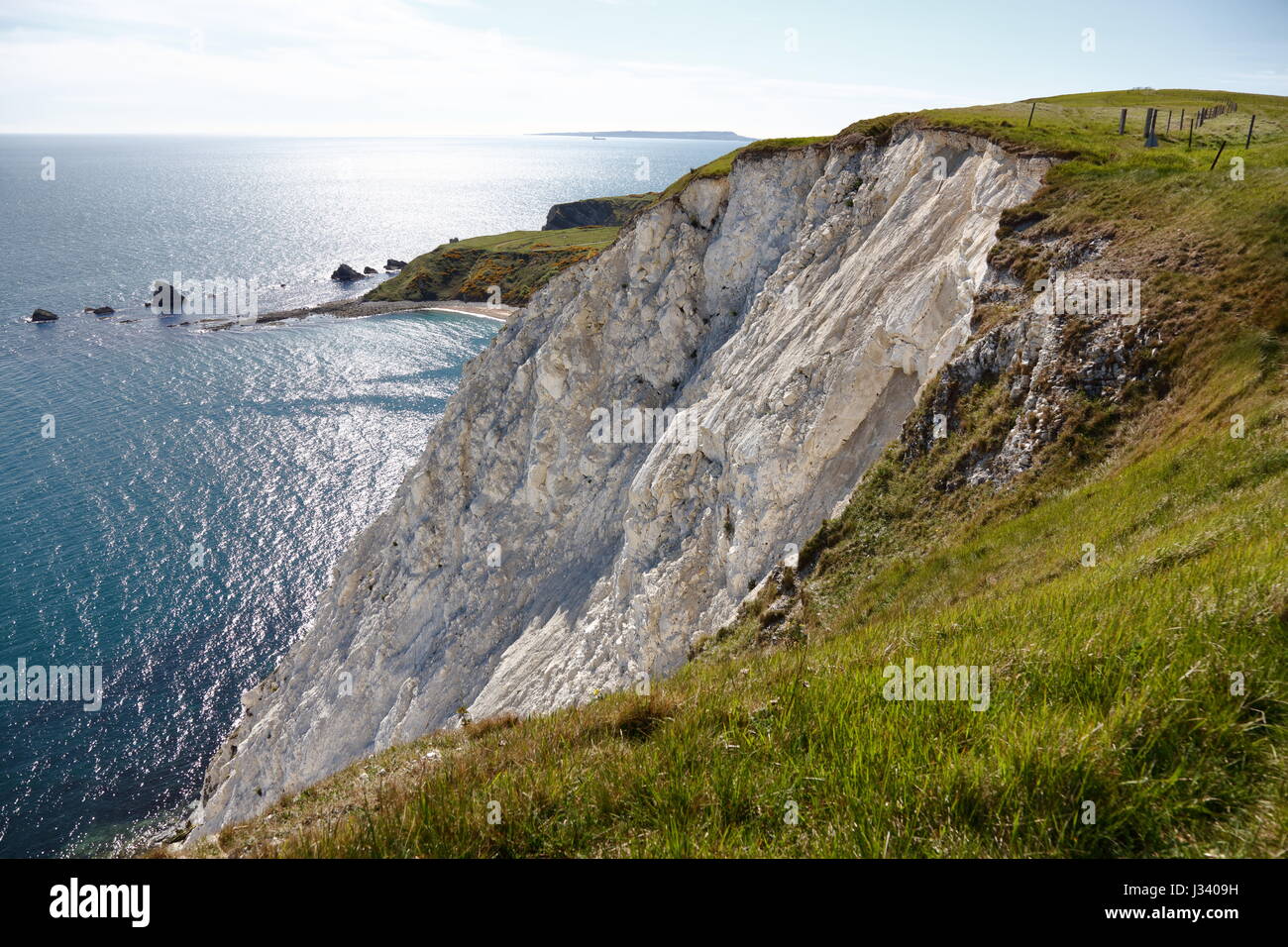 Crumbling chalk cliff and rock face from South West Coast Path between ...