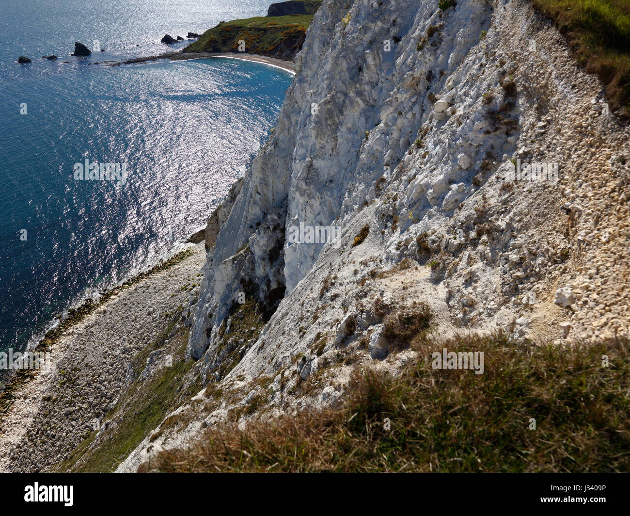 Crumbling chalk cliff and rock face from South West Coast Path between ...