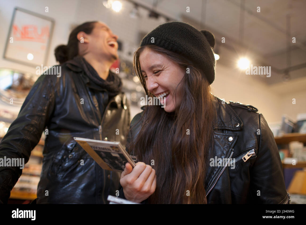 Young people browsing albums in a record store Stock Photo - Alamy