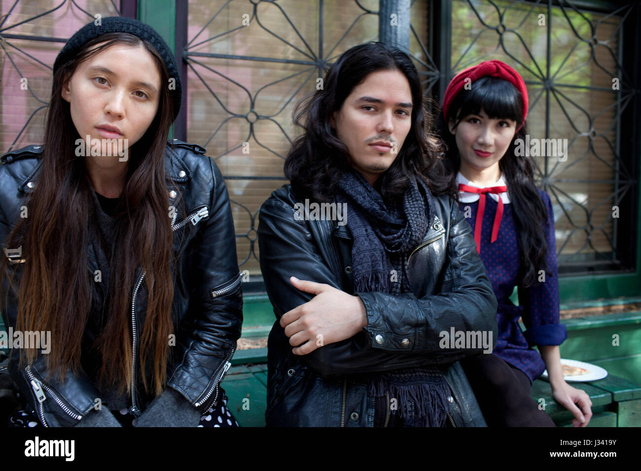 Friends hanging out in front of a building Stock Photo - Alamy