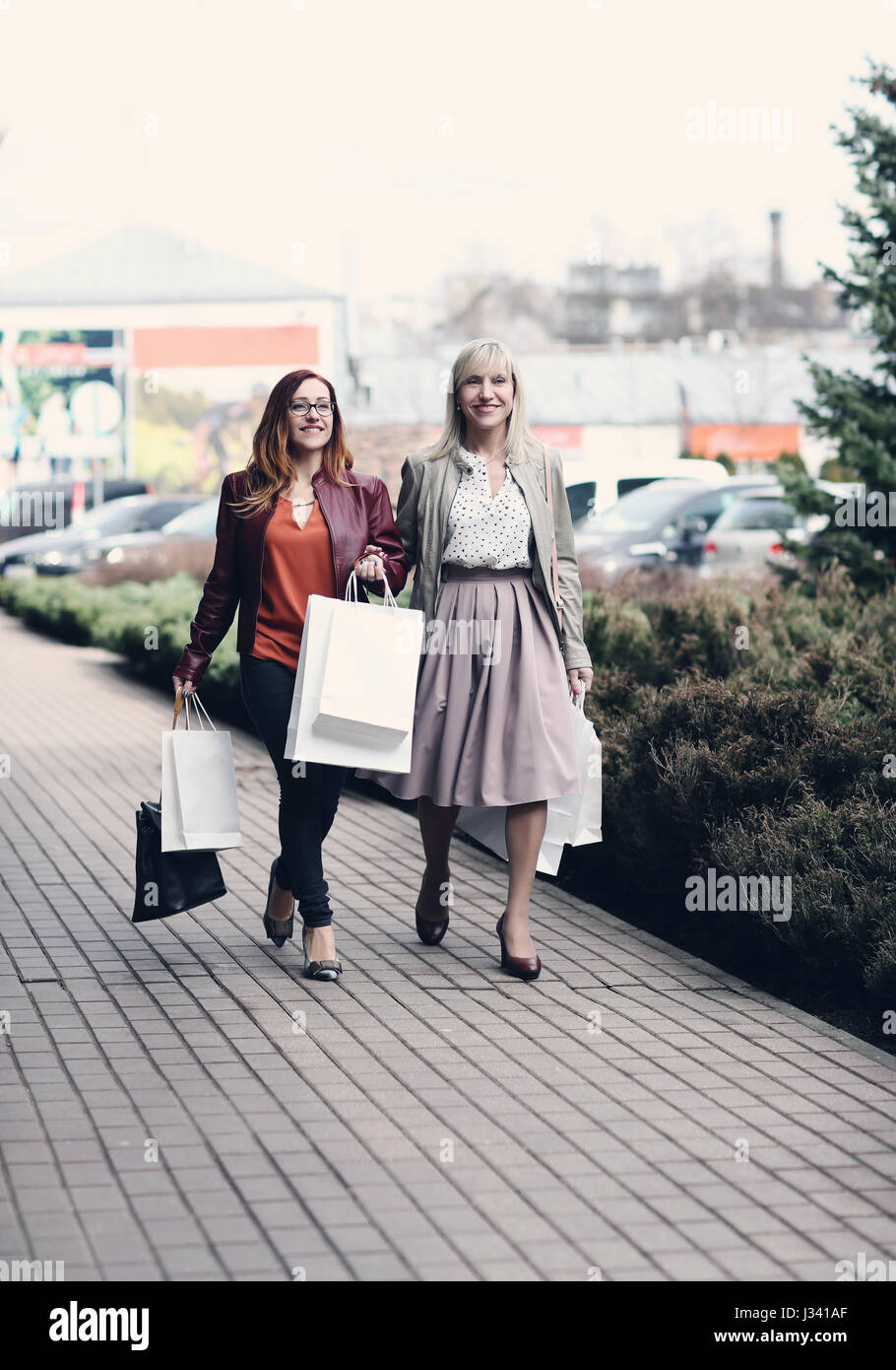 Clothing. Women went shopping together Stock Photo - Alamy