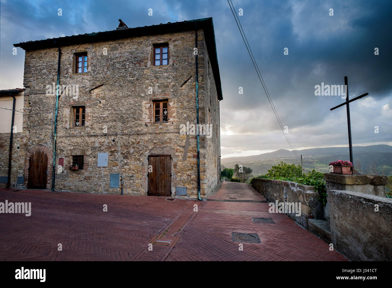 Montescudaio, Pisa, Tuscany, Italy, View of a typical house and cross ...
