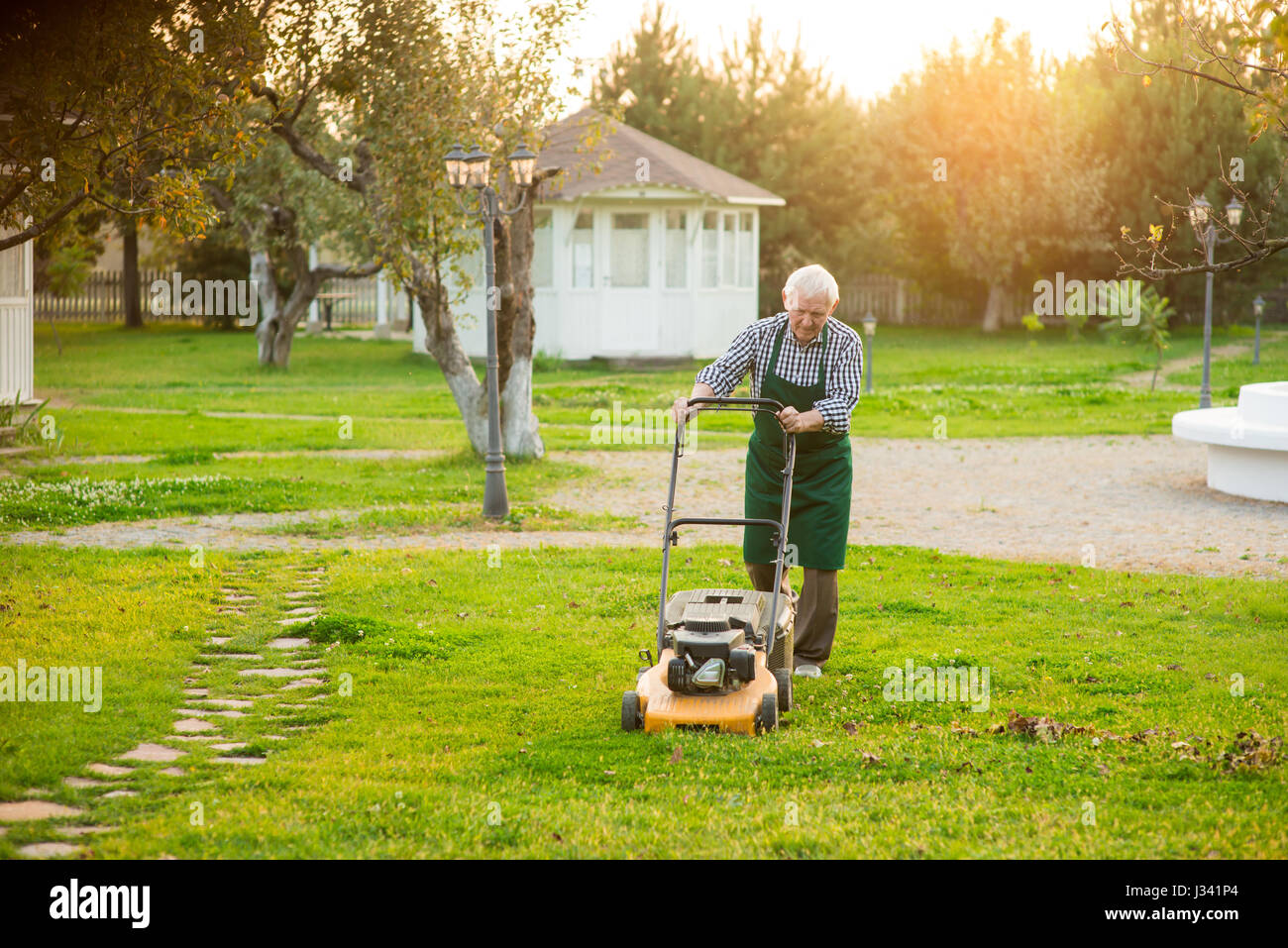 Old man lawn mower hi-res stock photography and images - Alamy