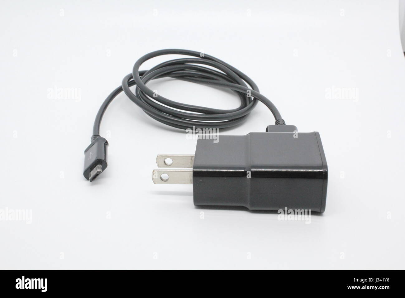 Smartphone charger on white background Stock Photo - Alamy