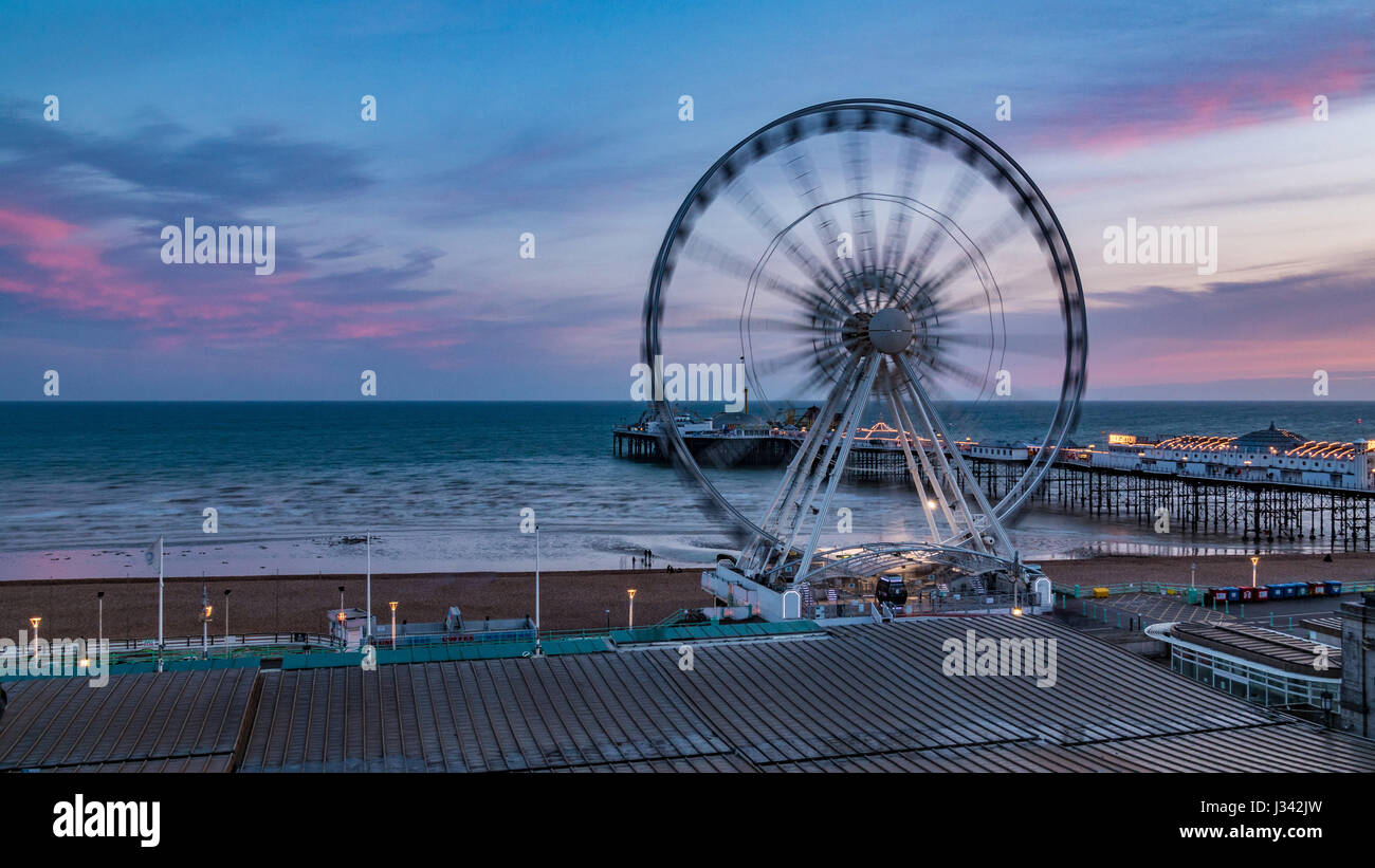 View of the Victorian Brighton Pier and the Brighton wheel at sunset ...