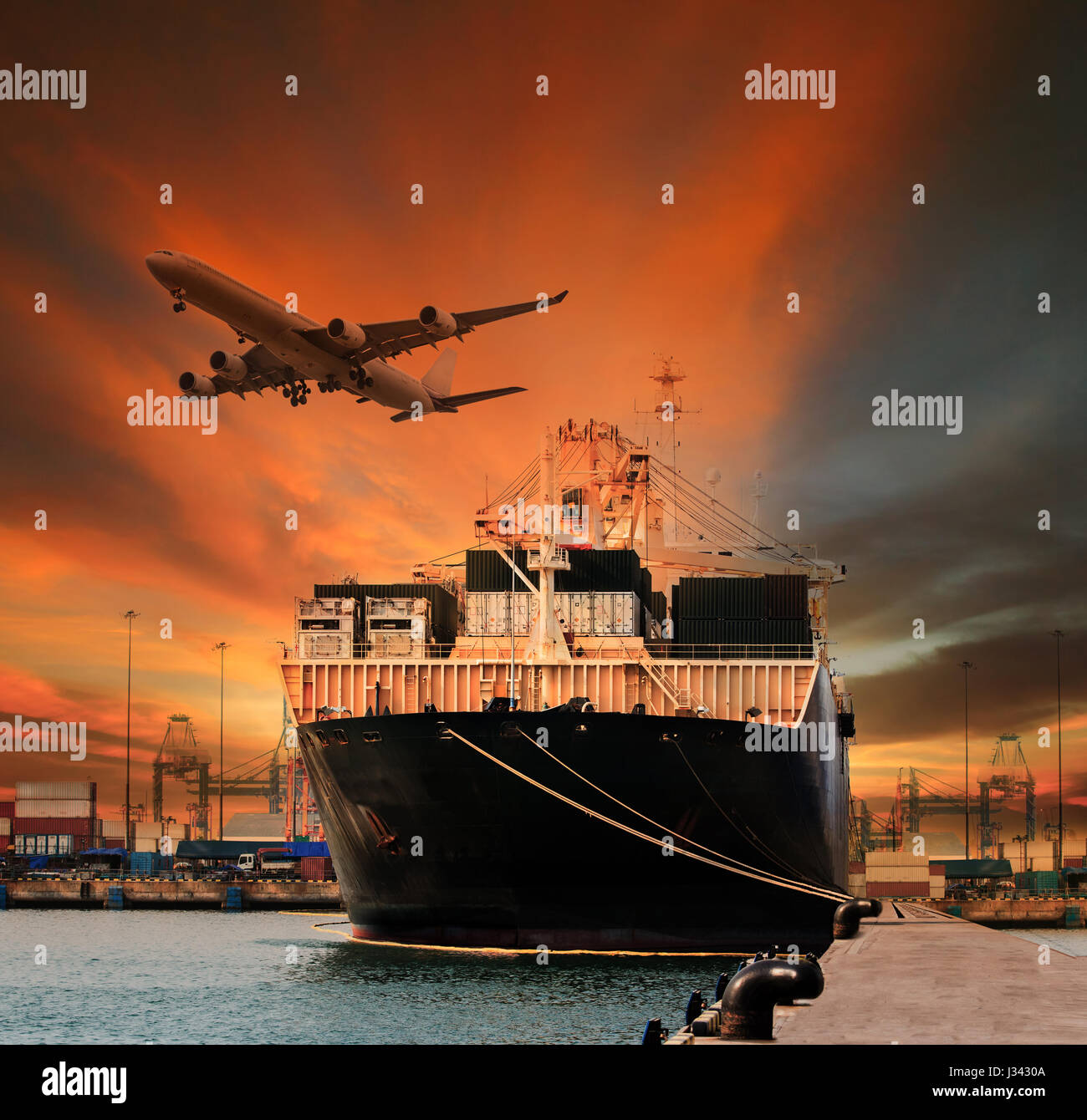 container ship and container in shipping port cargo plane flying above ...