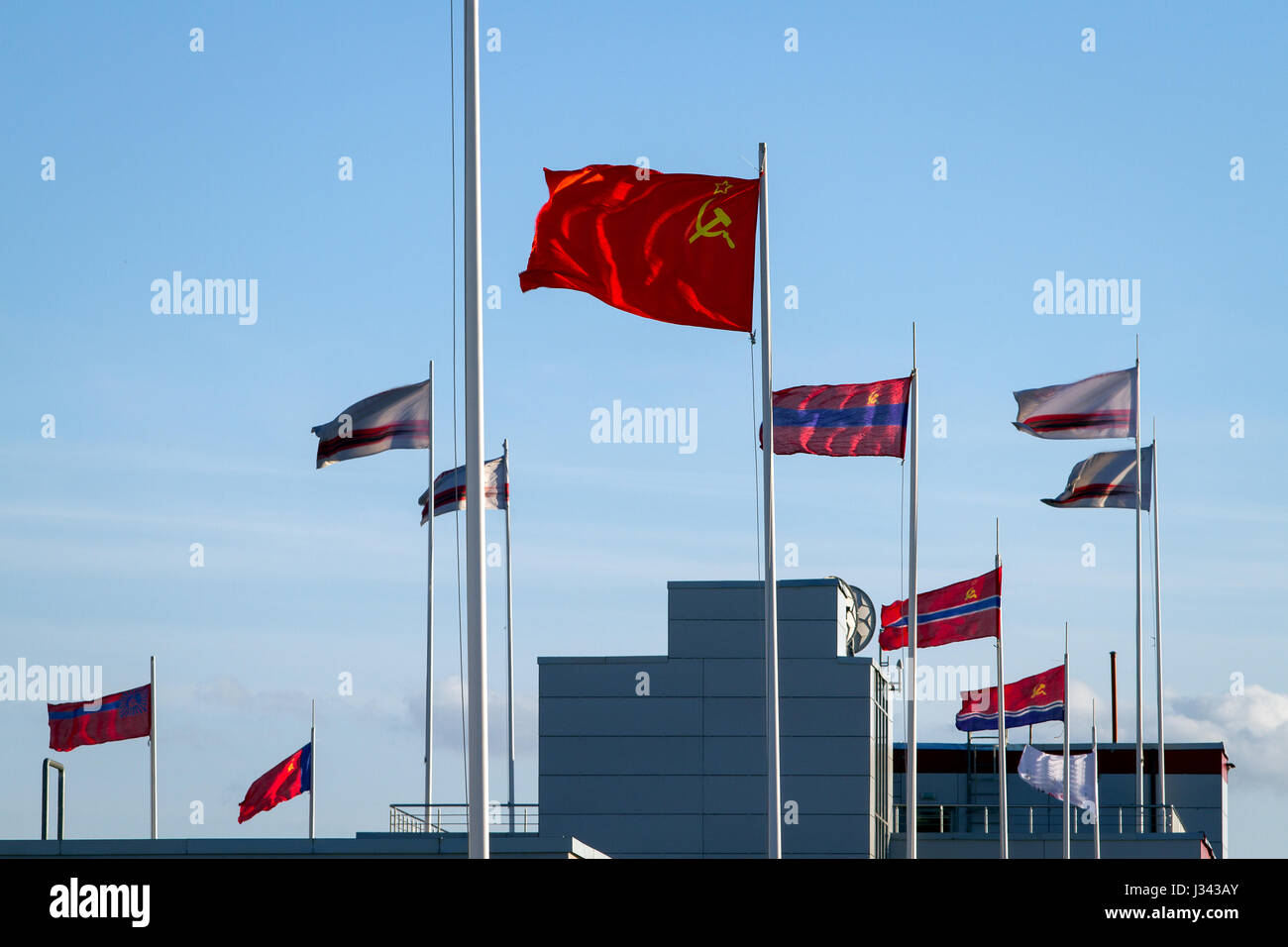 Flags of the USSR and Soviet republics on the background of blue sky ...