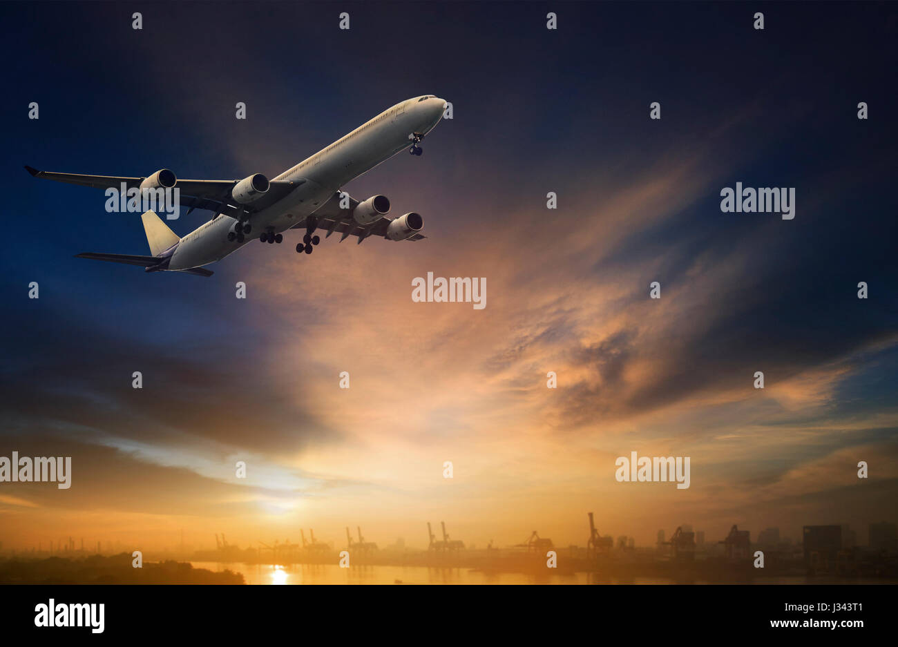 passenger plane flying on beautiful dusky sky Stock Photo - Alamy