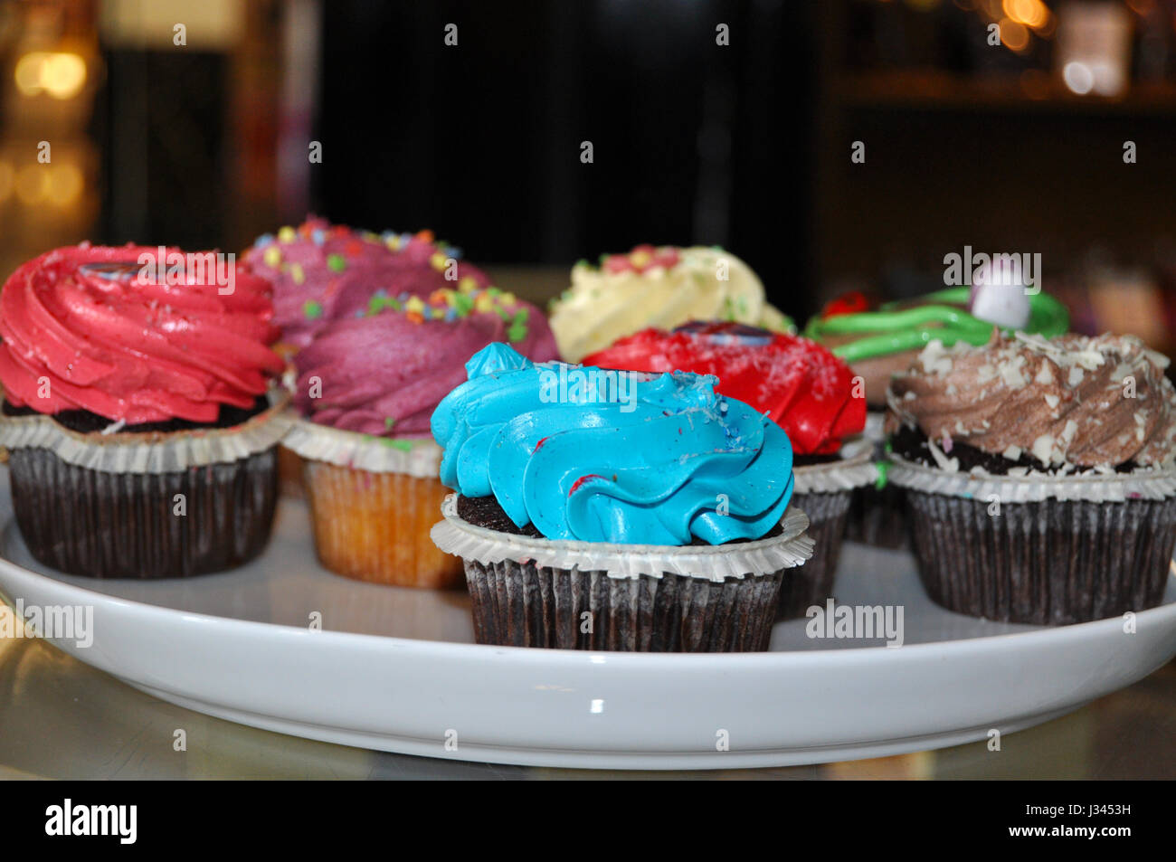 Bright colorful multicolored cupcakes in British museum cafe in London ...
