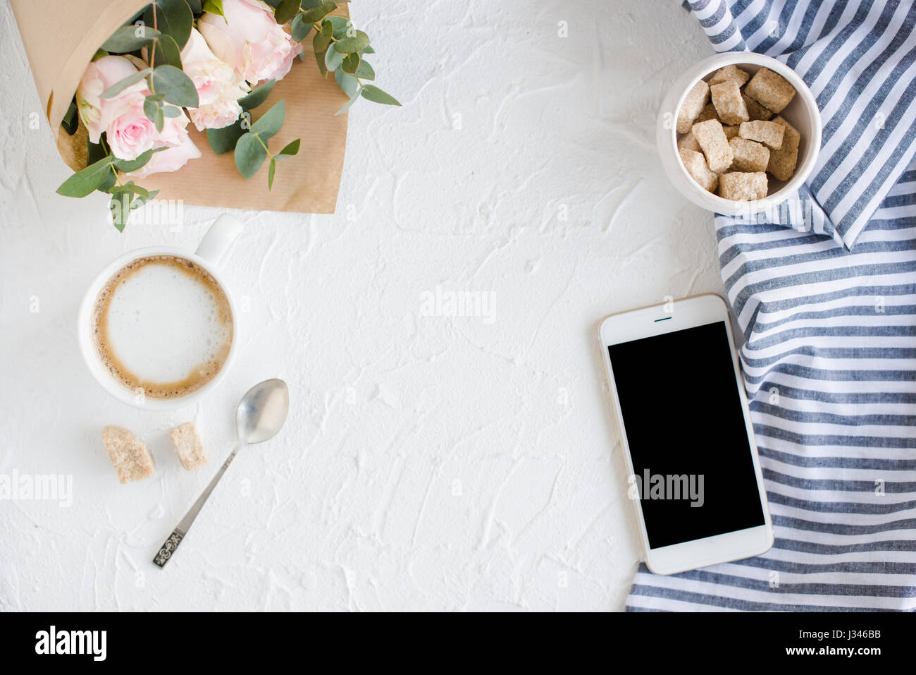 Romantic feminine background with coffee, smartphote mock-up and roses ...