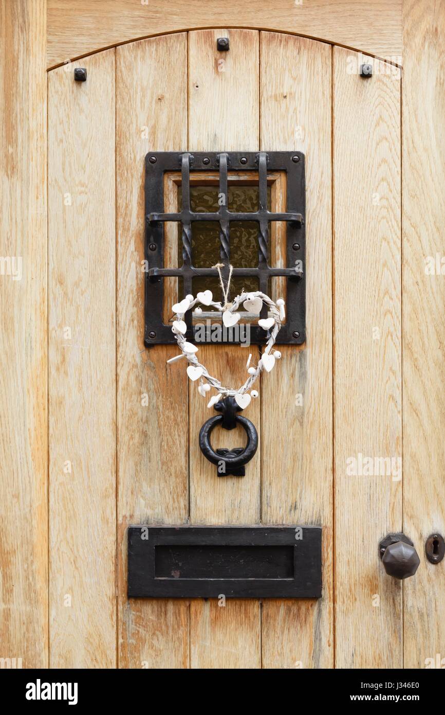 Traditional wooden front door of a house with ironmongery Stock Photo ...