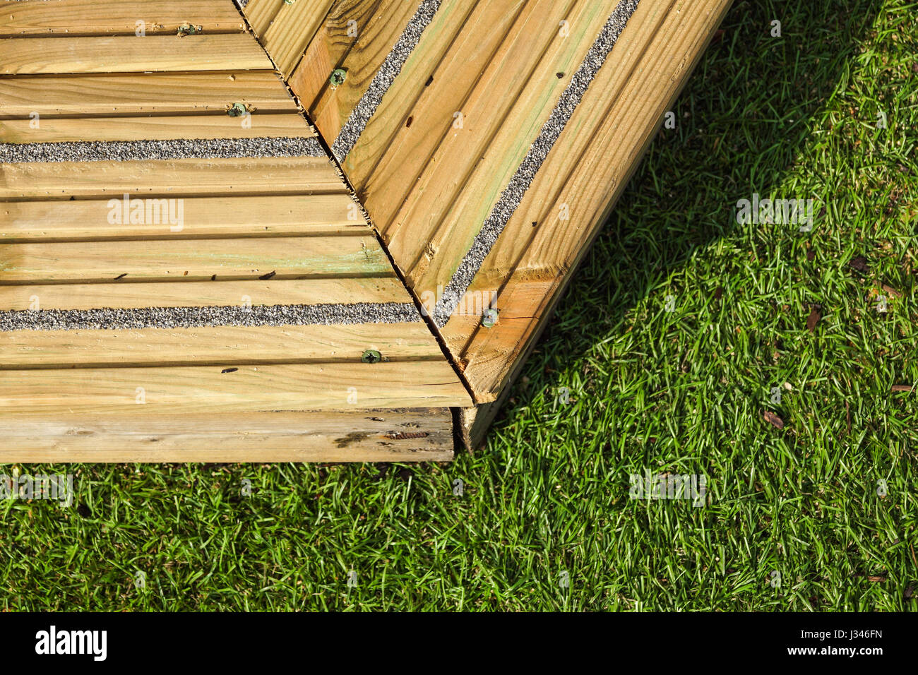 old wooden with green grass in the garden Stock Photo - Alamy