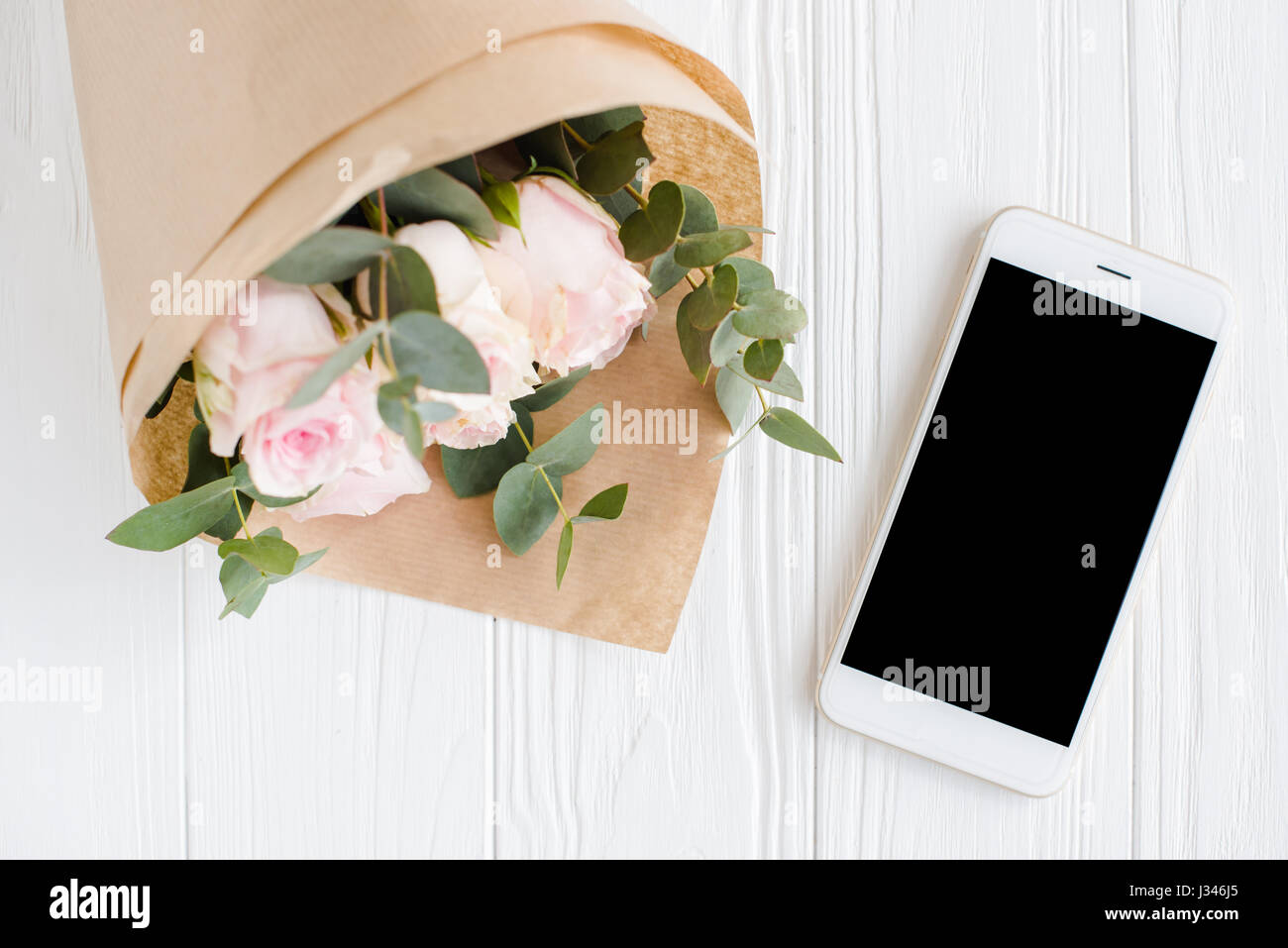 Simple feminine background with smartphote mock-up and roses on white ...