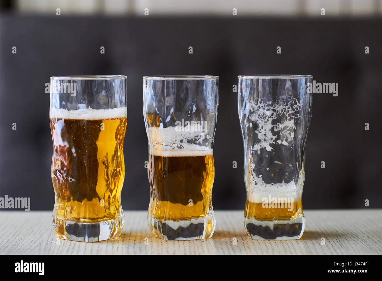 Three glasses of light beer Stock Photo - Alamy