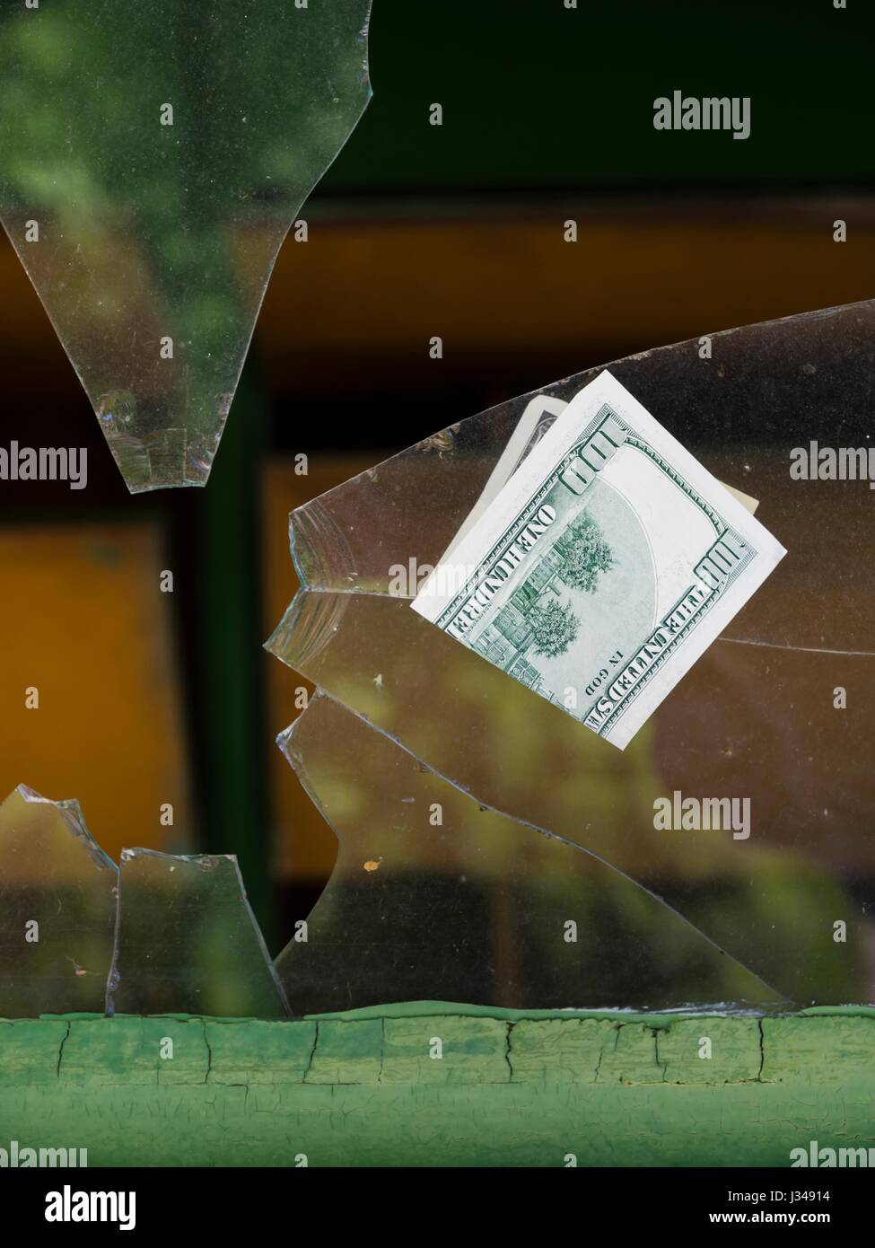 Money broken window Stock Photo - Alamy