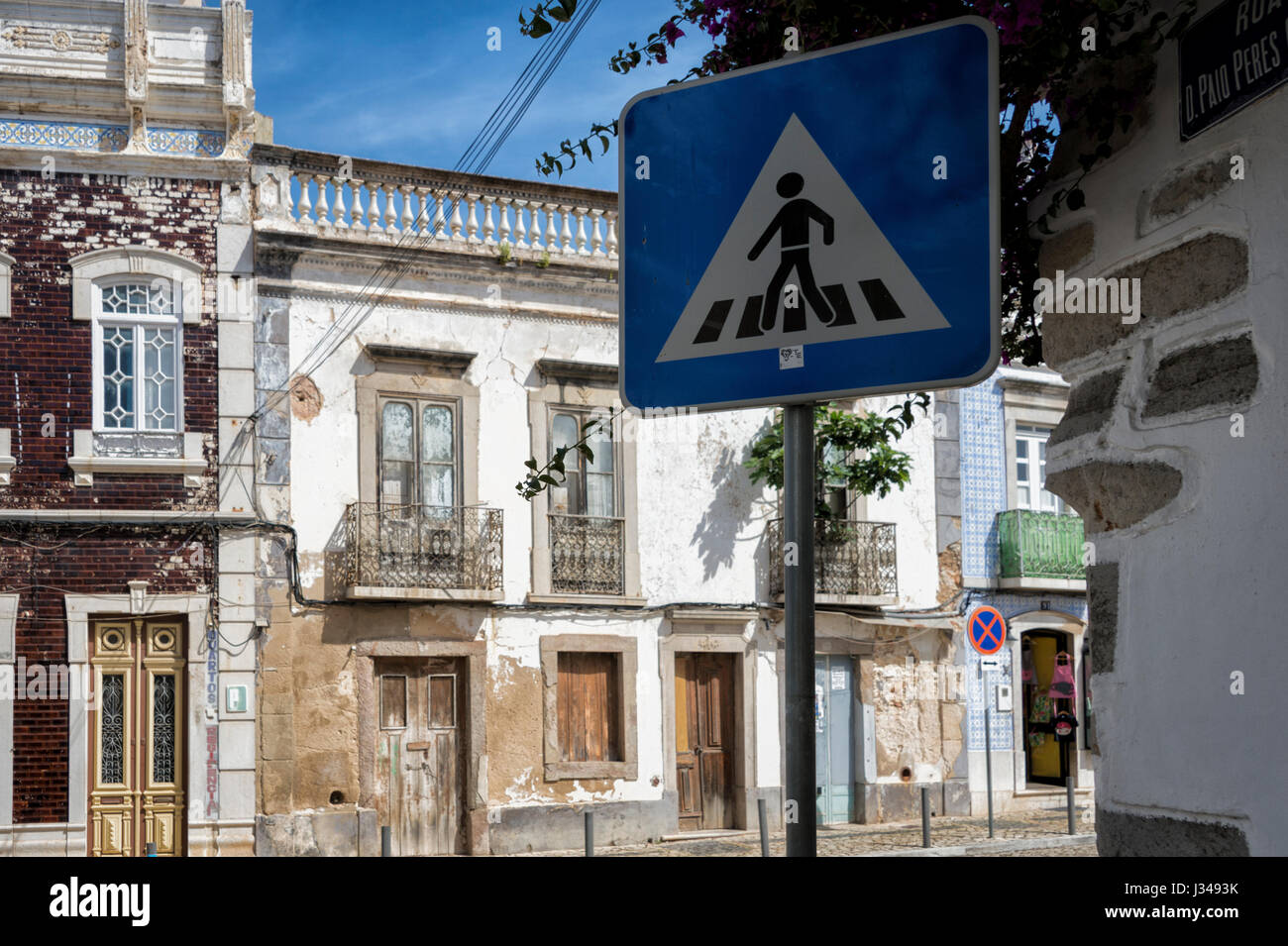 pedestrian crossing sign in the streets of Tavira, Portugal Stock Photo ...