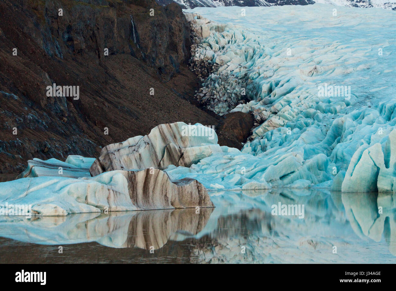 The rugged shapes of glacier ice, with its characteristic cobalt blue ...