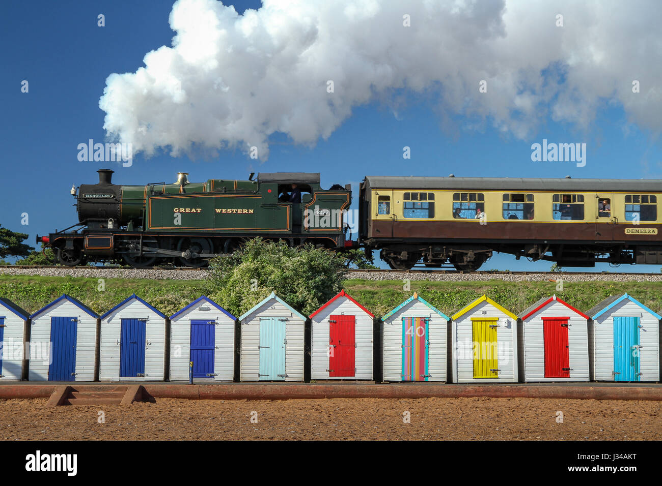 Steam train beach huts hi-res stock photography and images - Alamy
