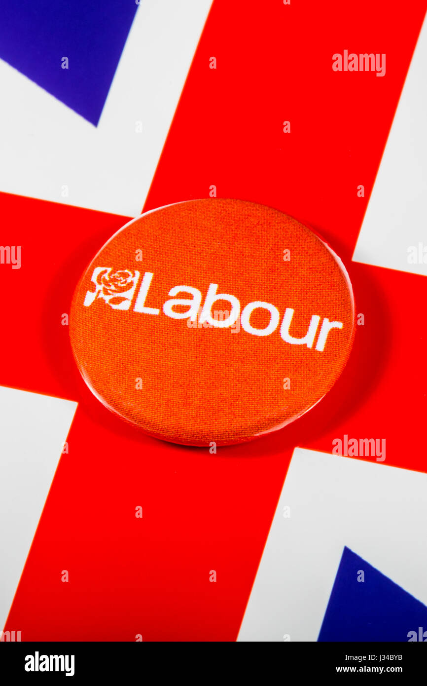 LONDON, UK - MAY 2ND 2017: A Labour Party pin badge over the UK flag ...
