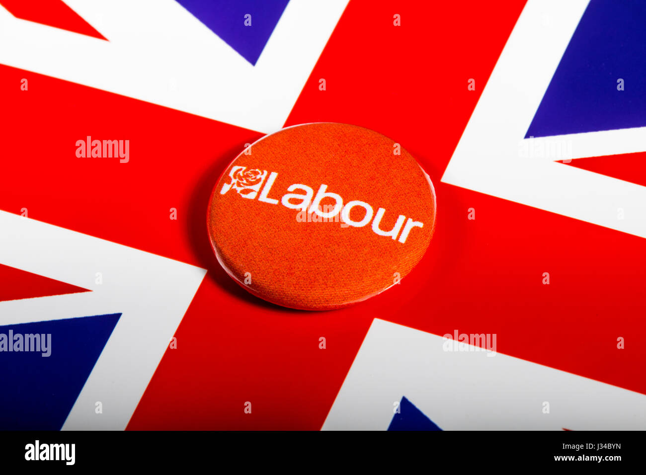 LONDON, UK - MAY 2ND 2017: A Labour Party pin badge over the UK flag ...