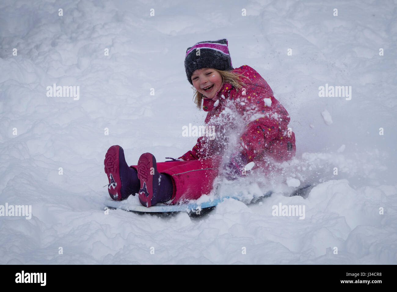 Child sliding down slope hi-res stock photography and images - Alamy