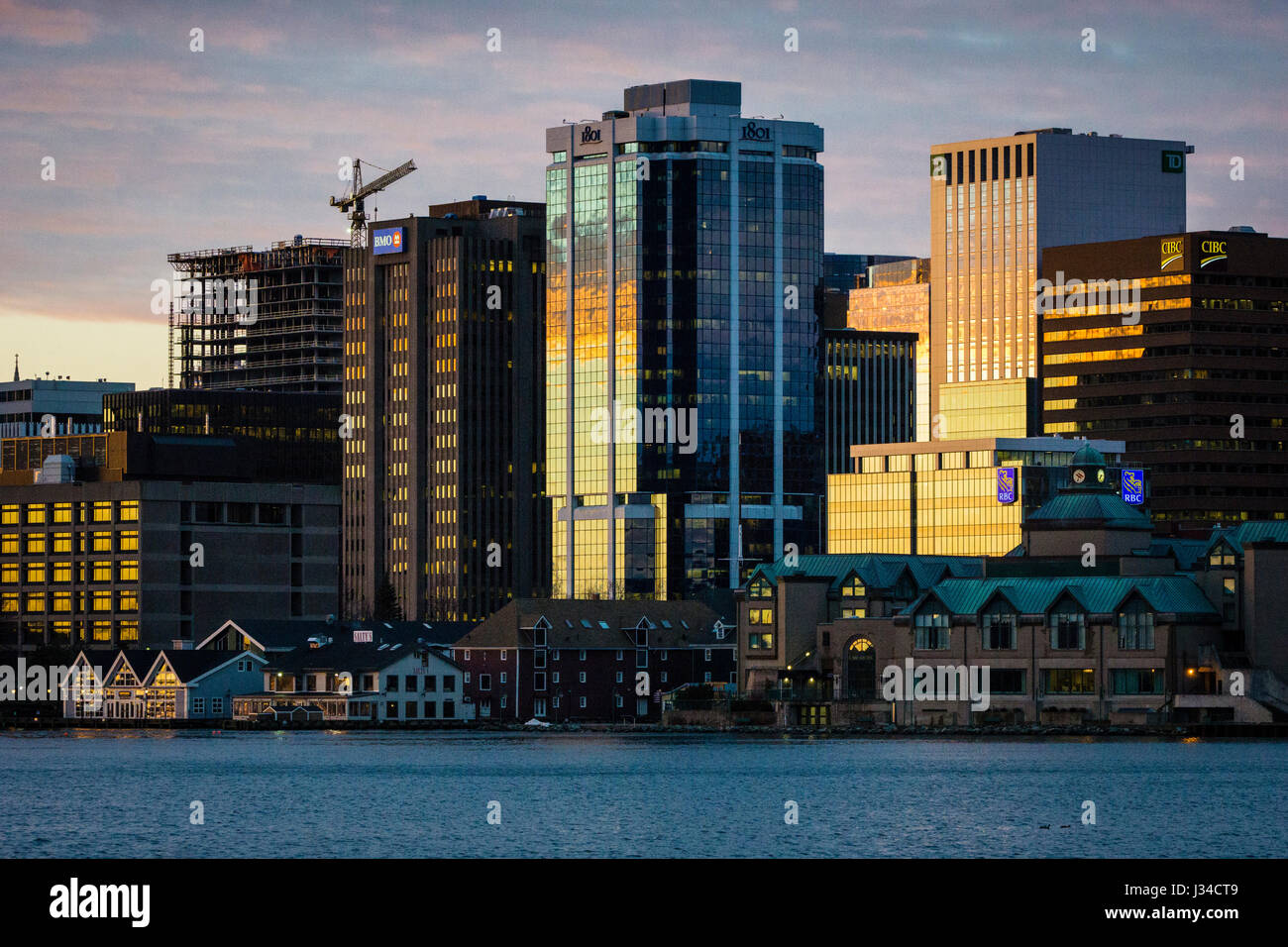 Office towers reflect the dawn sky on the waterfront at Halifax, Nova ...