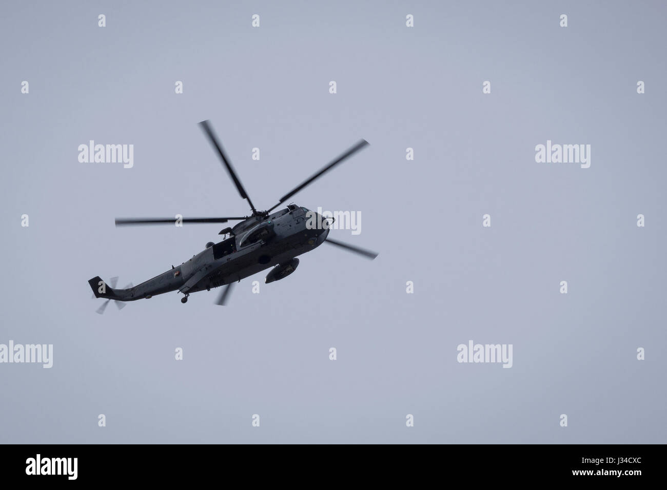 A Sikorsky Sea King helicopter flying overhead Stock Photo - Alamy