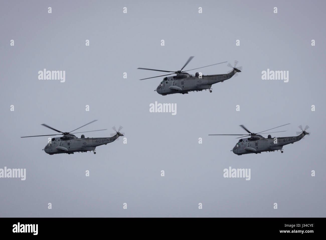 Three Sikorsky Sea King helicopters flying in formation Stock Photo - Alamy