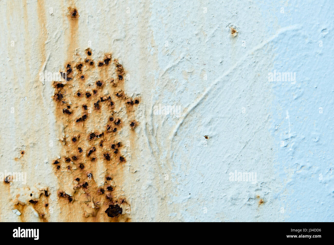 Rusted steel wall, once painted Stock Photo - Alamy
