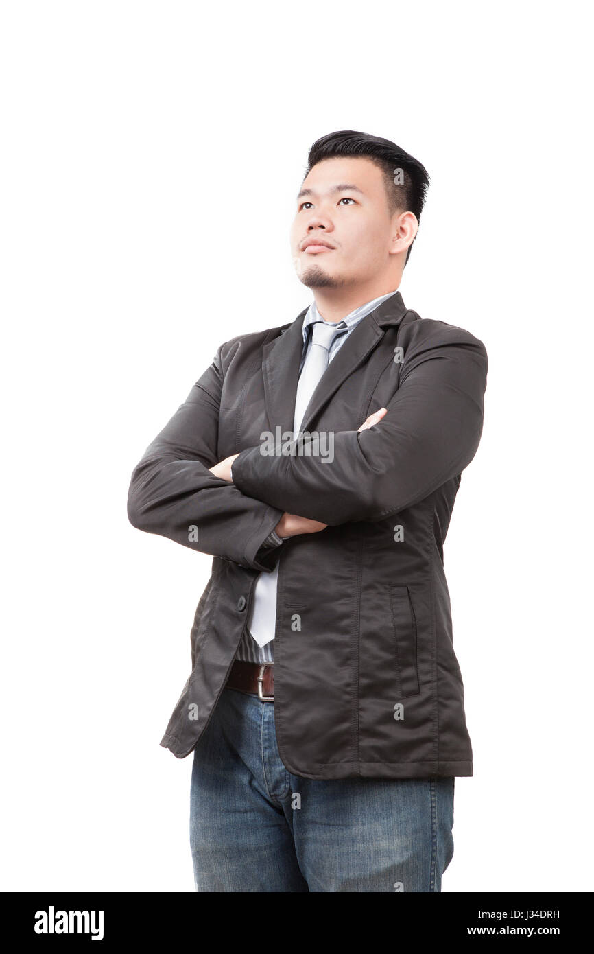 face of young asian man wearing western suit standing and looking upper ...