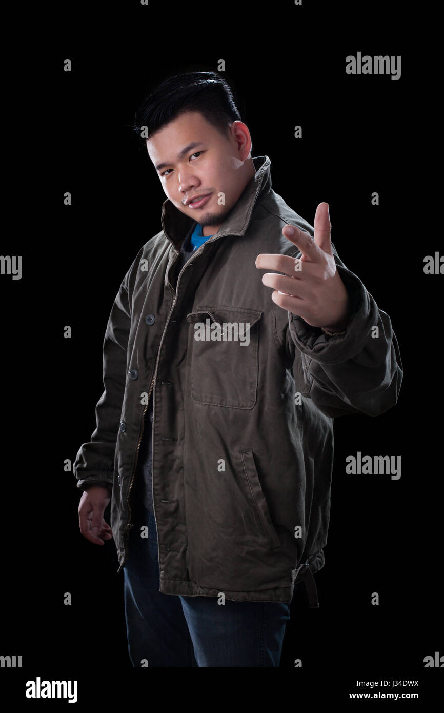 bad boy on dark background Stock Photo - Alamy
