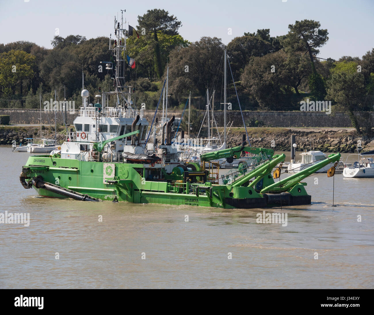 The dredger Dhamra maneuvering in the port of Verdon-sur-Mer Stock ...