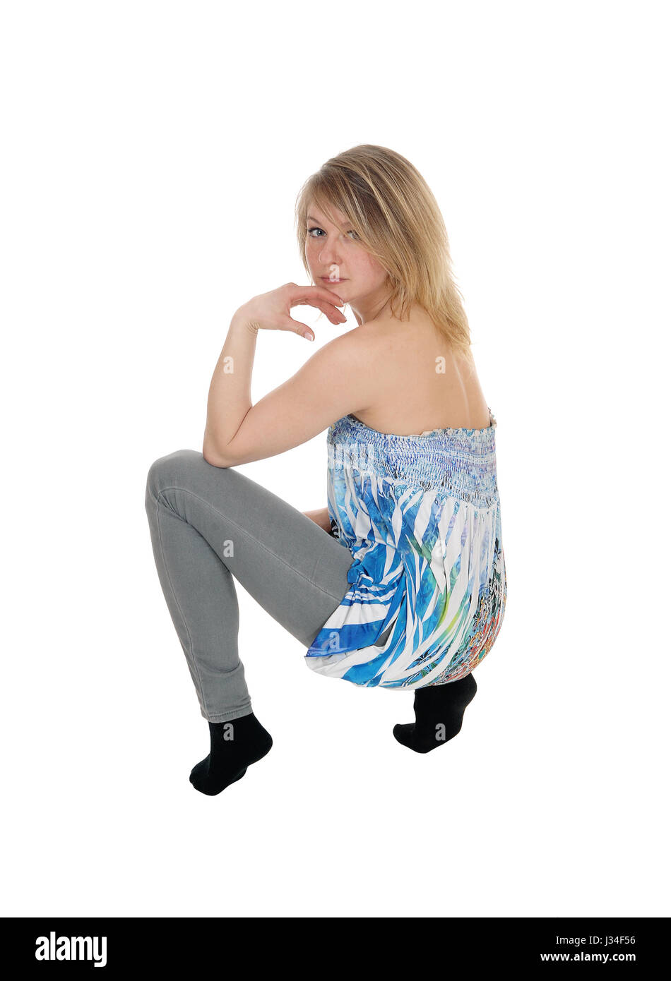 Woman crouching down isolated hi-res stock photography and images - Alamy