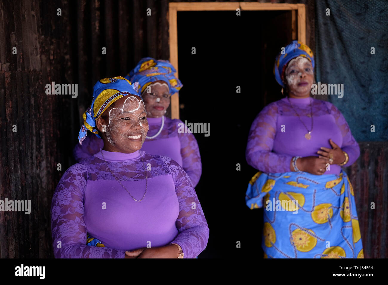 Women with their faces covered with a natural white mask called musiro ...