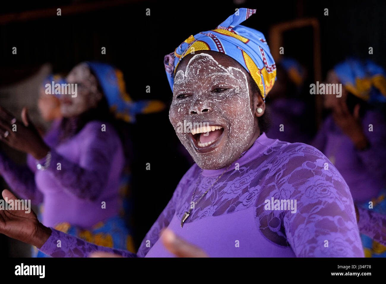 African women with their faces covered with a natural white mask called ...