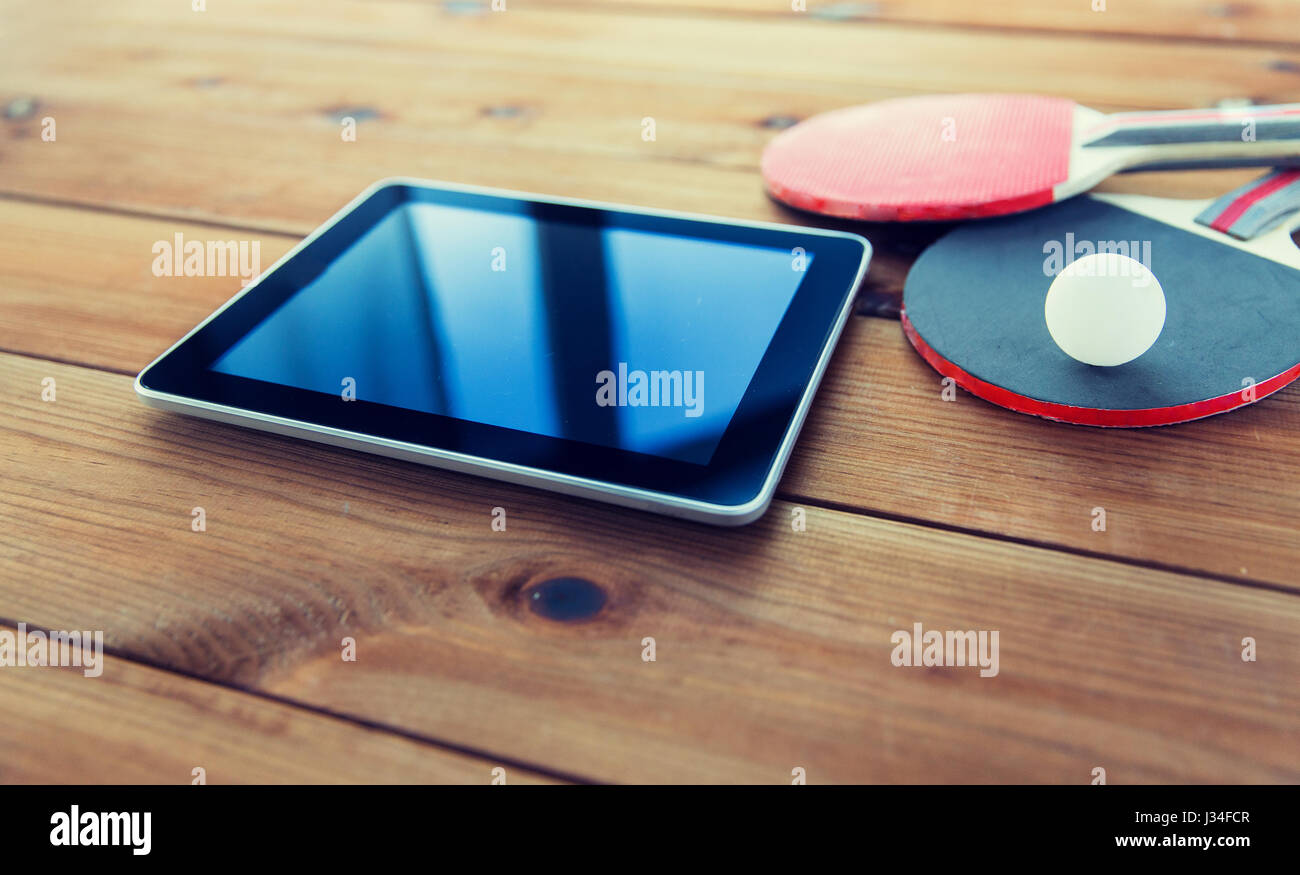 close up of table tennis rackets and tablet pc Stock Photo - Alamy