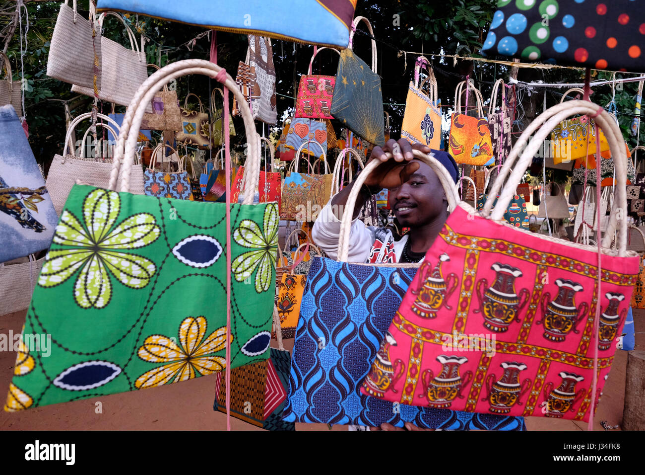 A vendor at the craft market of Maputo, the capital city of Mozambique ...