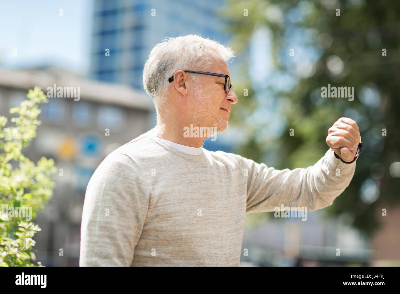 Old man outdoors checking hi-res stock photography and images - Alamy