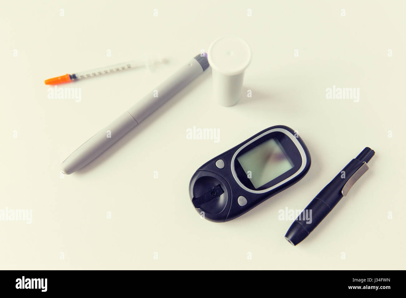 close up of glucometer, insulin pen and syringe Stock Photo - Alamy