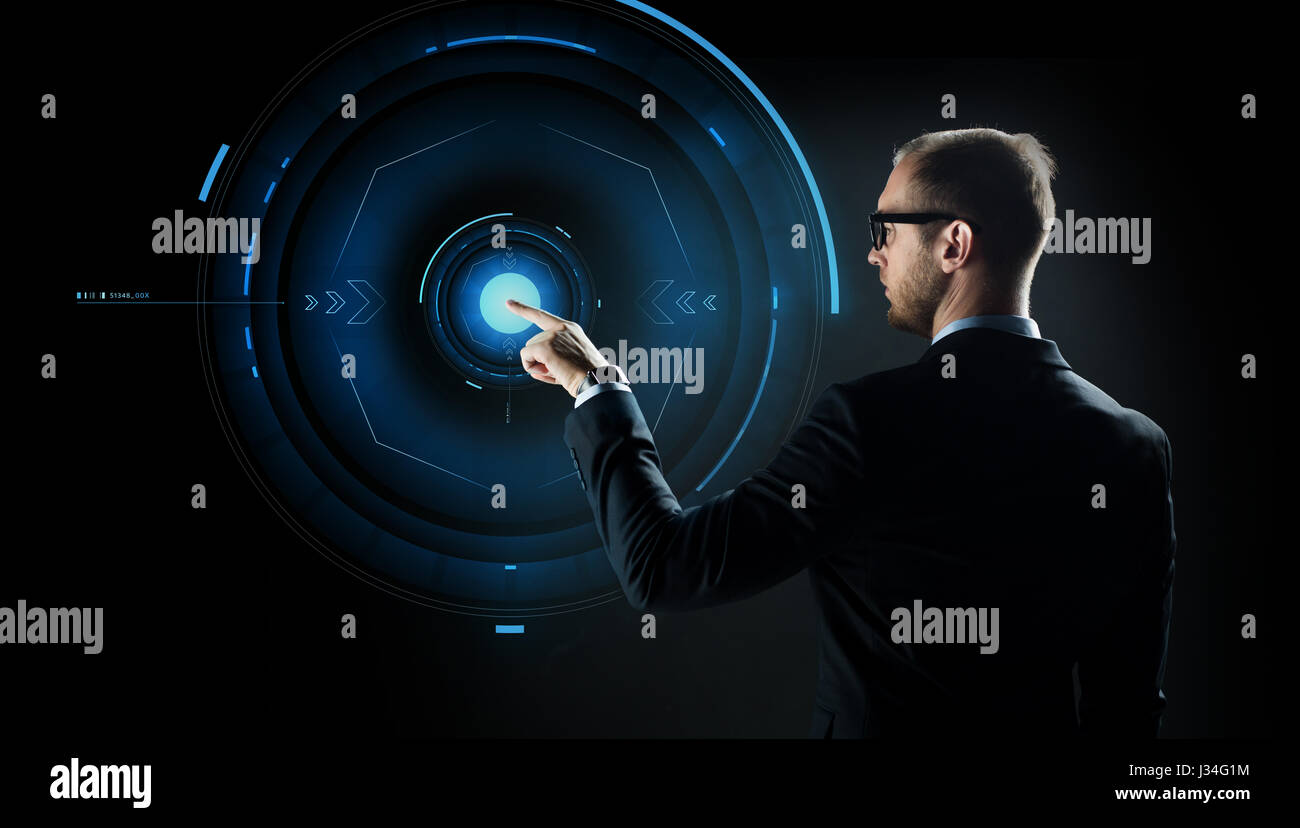 businessman pointing finger to virtual projection Stock Photo - Alamy