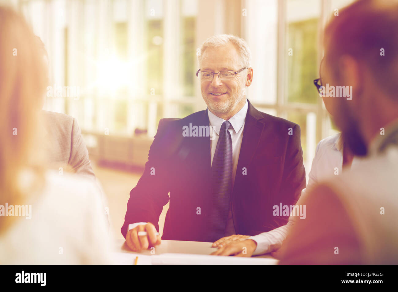 smiling business people meeting in office Stock Photo - Alamy