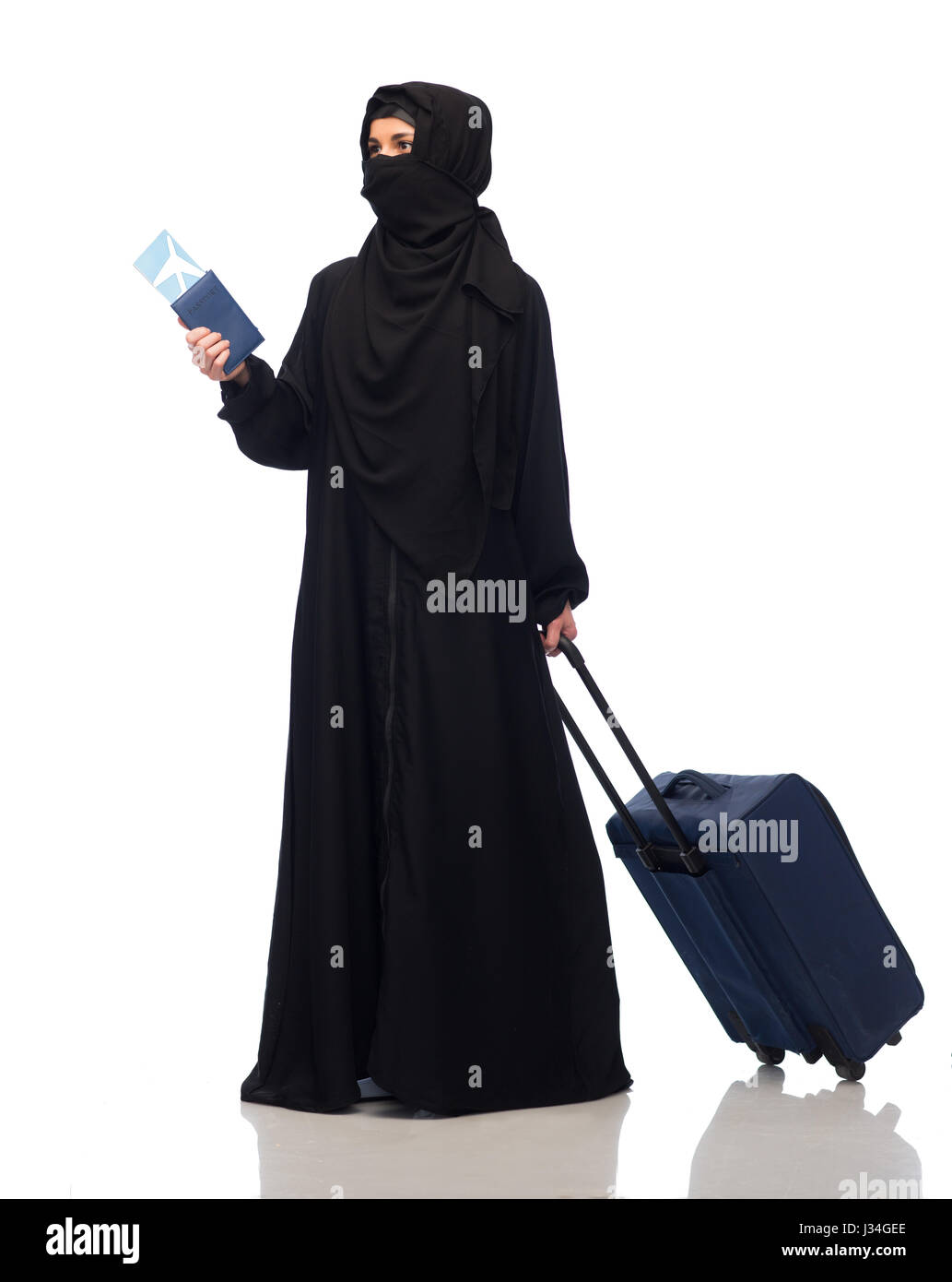 muslim woman with ticket, passport and travel bag Stock Photo - Alamy