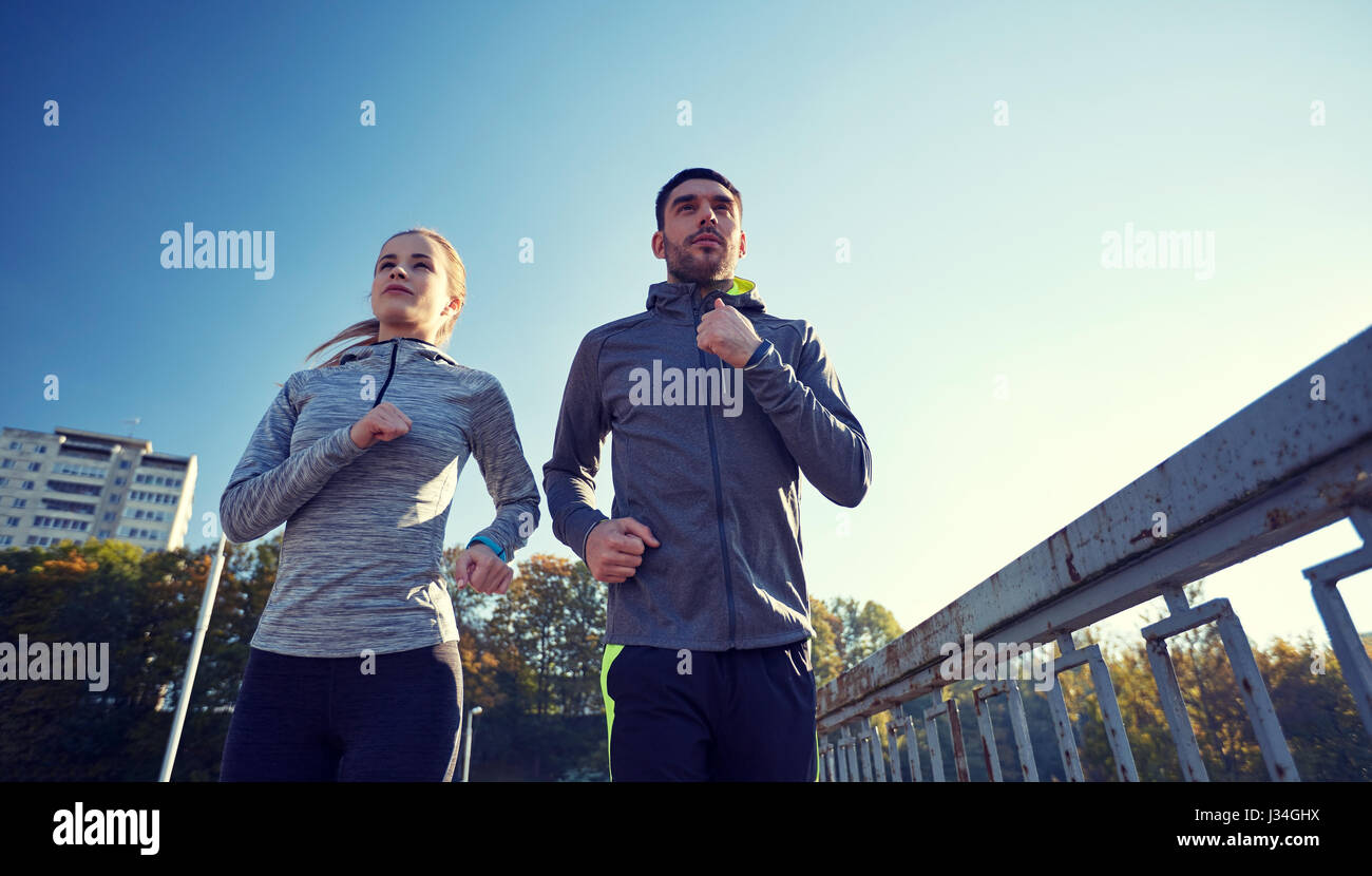 couple running outdoors Stock Photo - Alamy